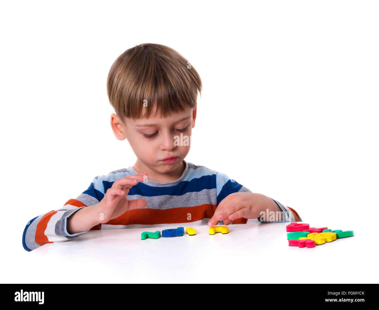 Boy playing with blocks at table hi-res stock photography and images ...
