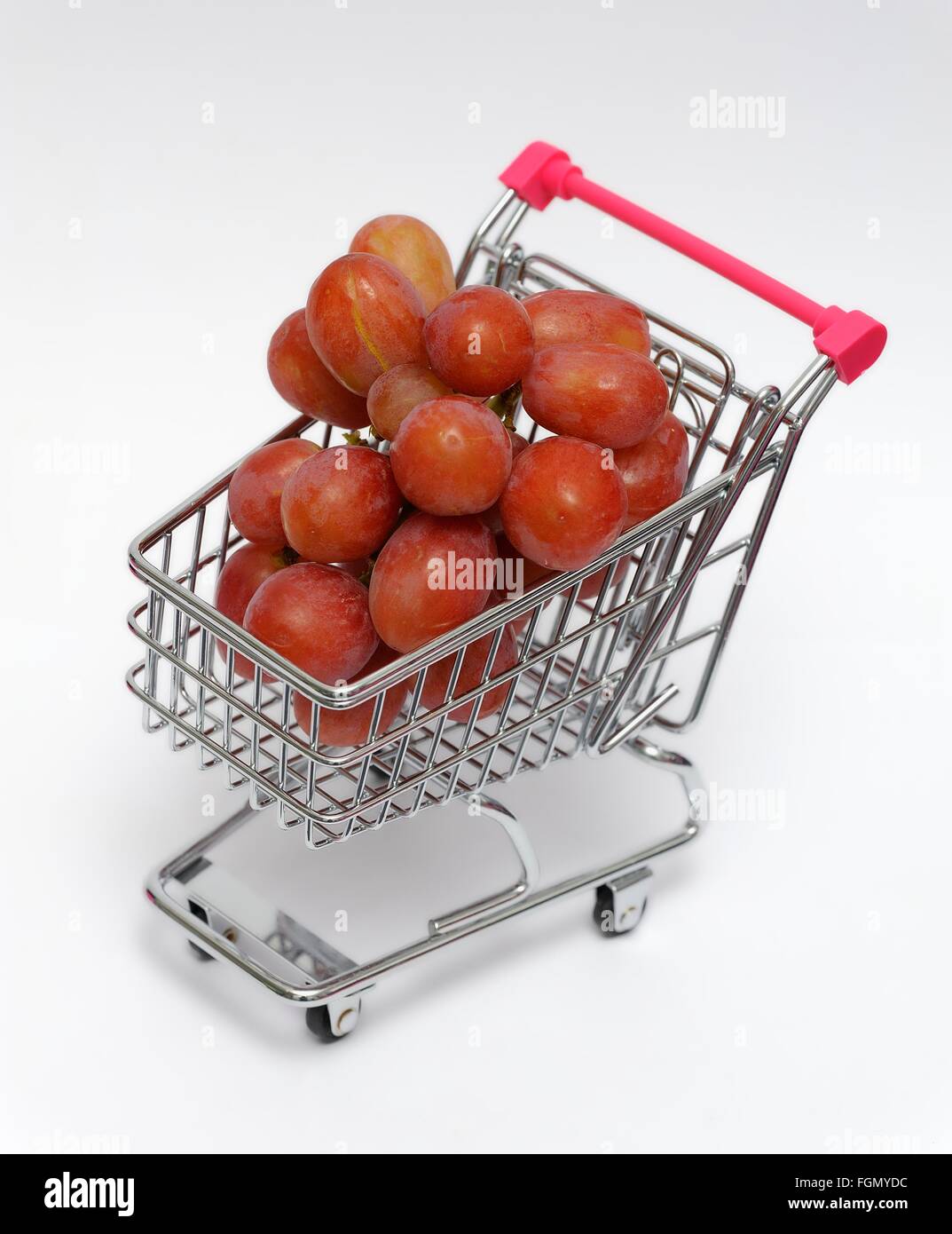 Red seedless grapes in a miniature shopping trolley cart Stock Photo ...