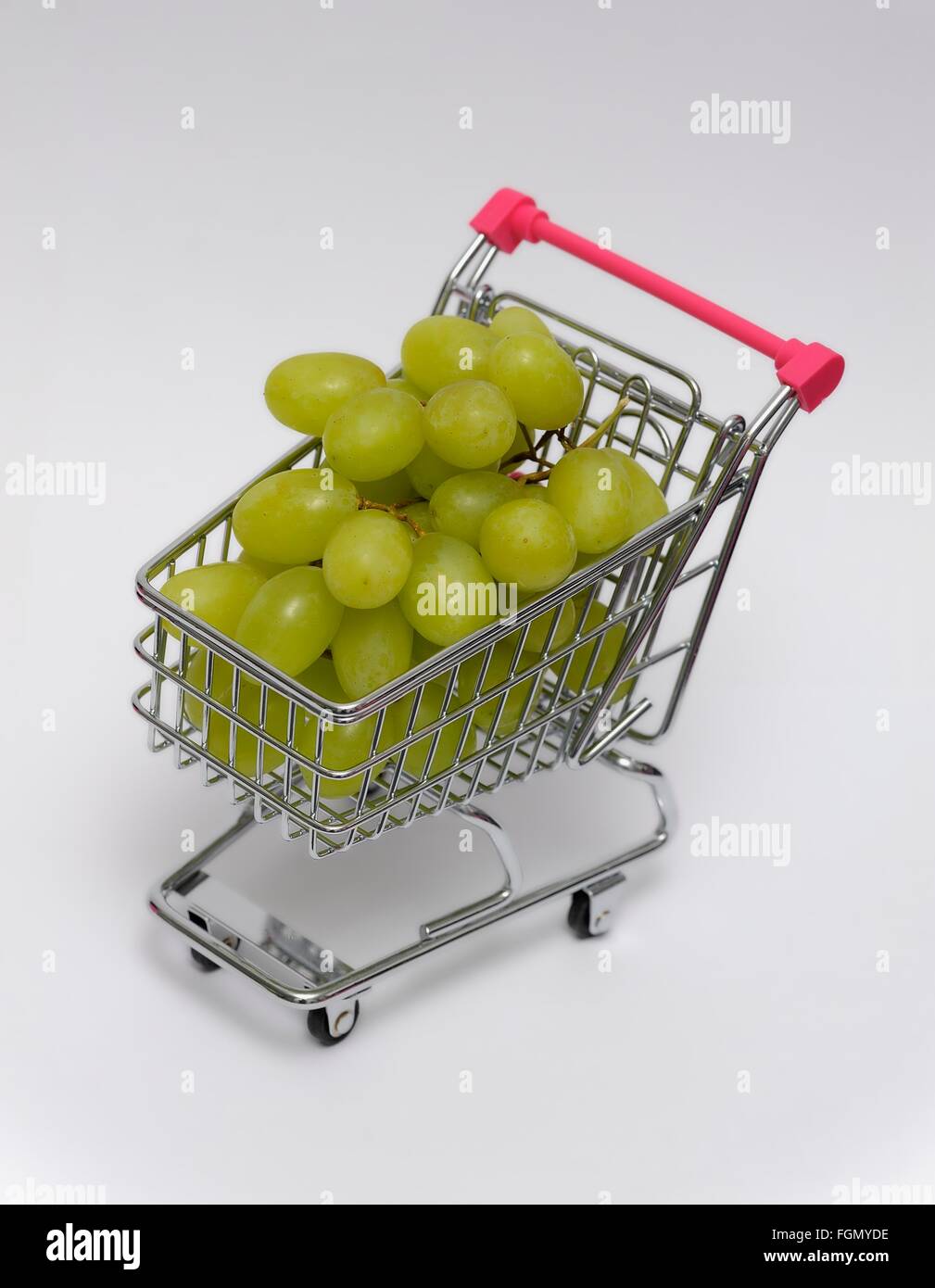 Green seedless grapes in a miniature shopping trolley cart Stock Photo ...