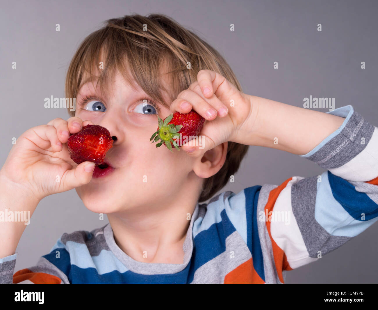 boy eating strawberries Stock Photo - Alamy boy eating strawberries Stock Photo - Alamy