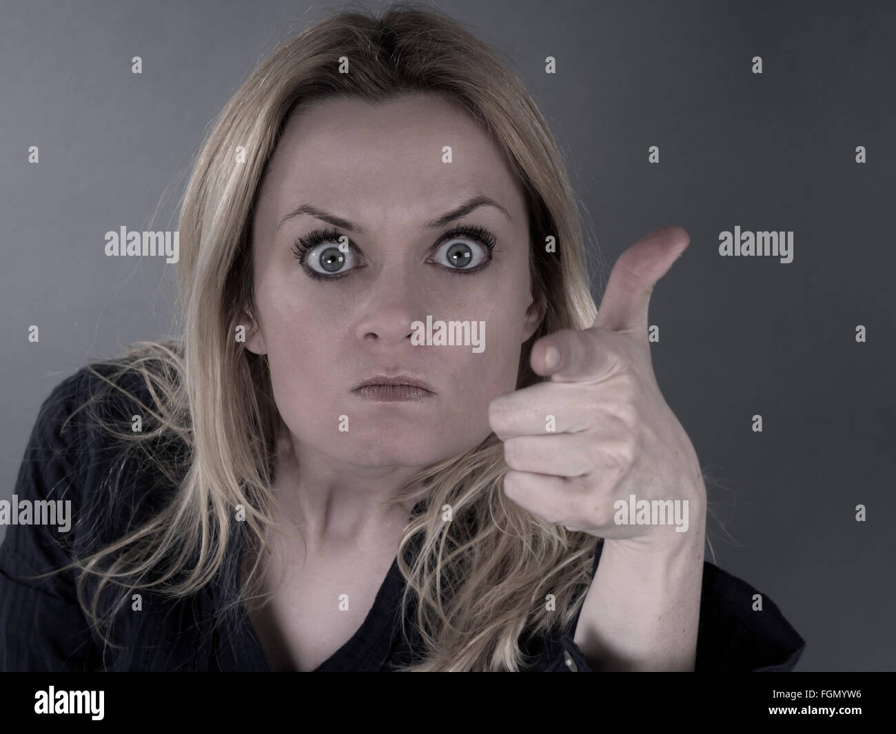 Confident woman pointing out Stock Photo - Alamy Confident woman pointing out Stock Photo - Alamy