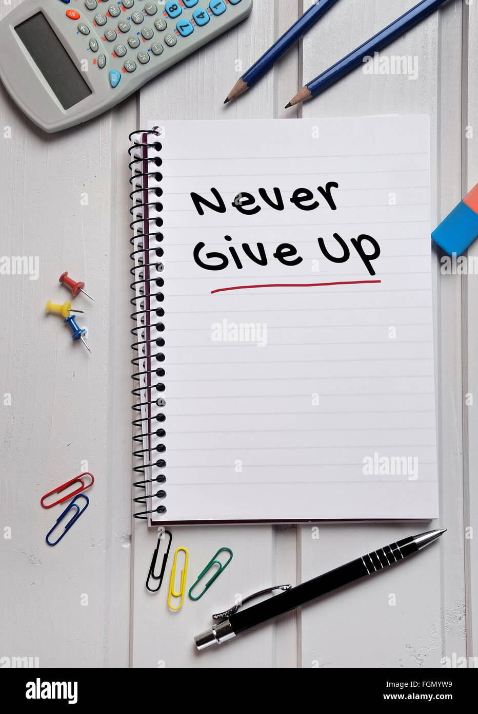 Never give up word on notebook page Stock Photo - Alamy
