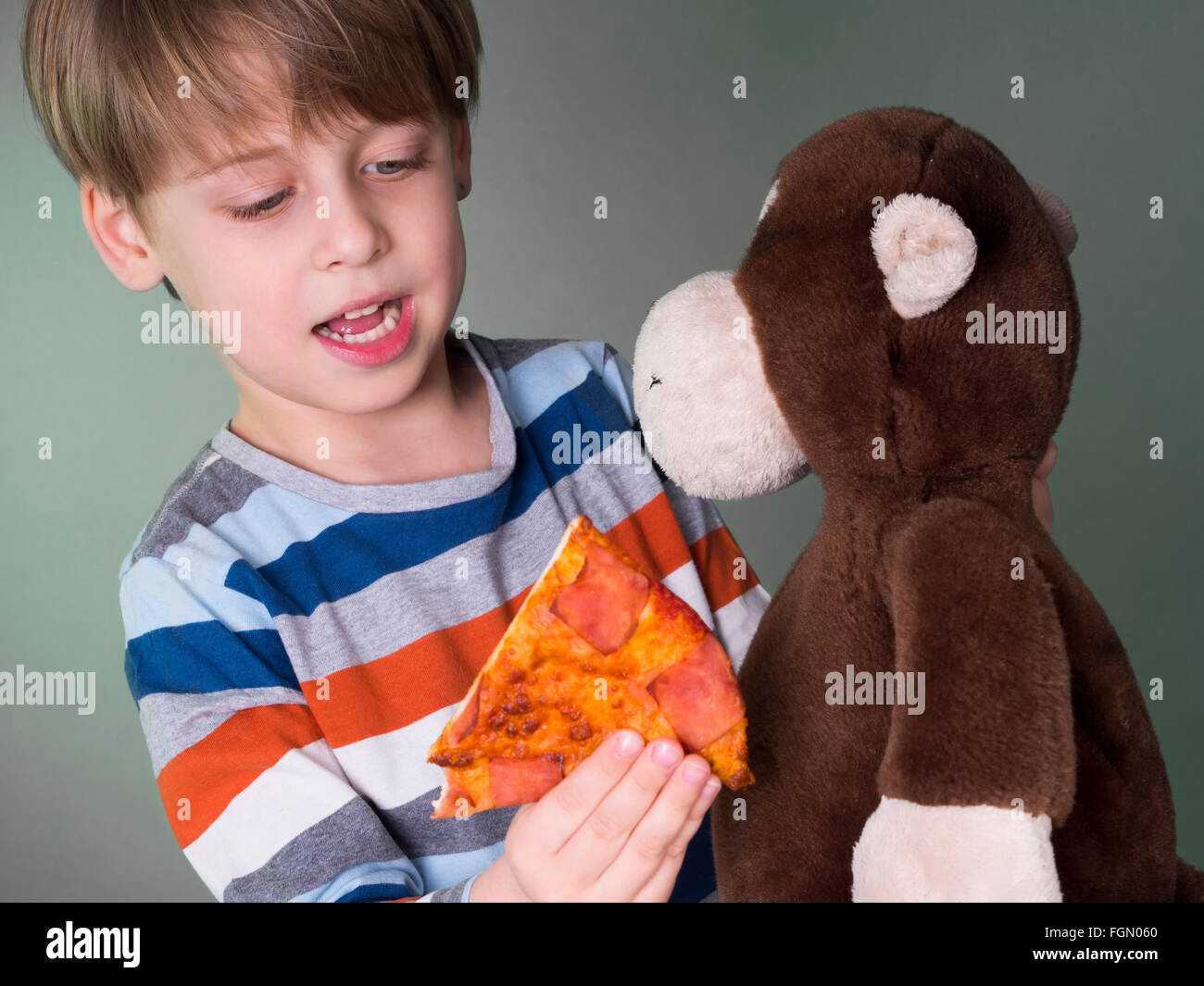 boy feeding money with pizza Stock Photo - Alamy