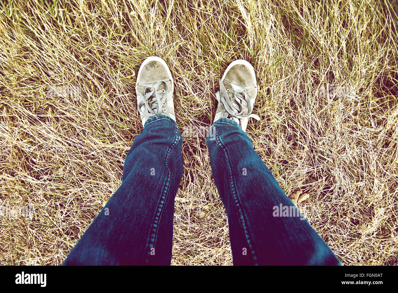 Teenage hipster legs on grass. Instagram vintage picture Stock Photo ...
