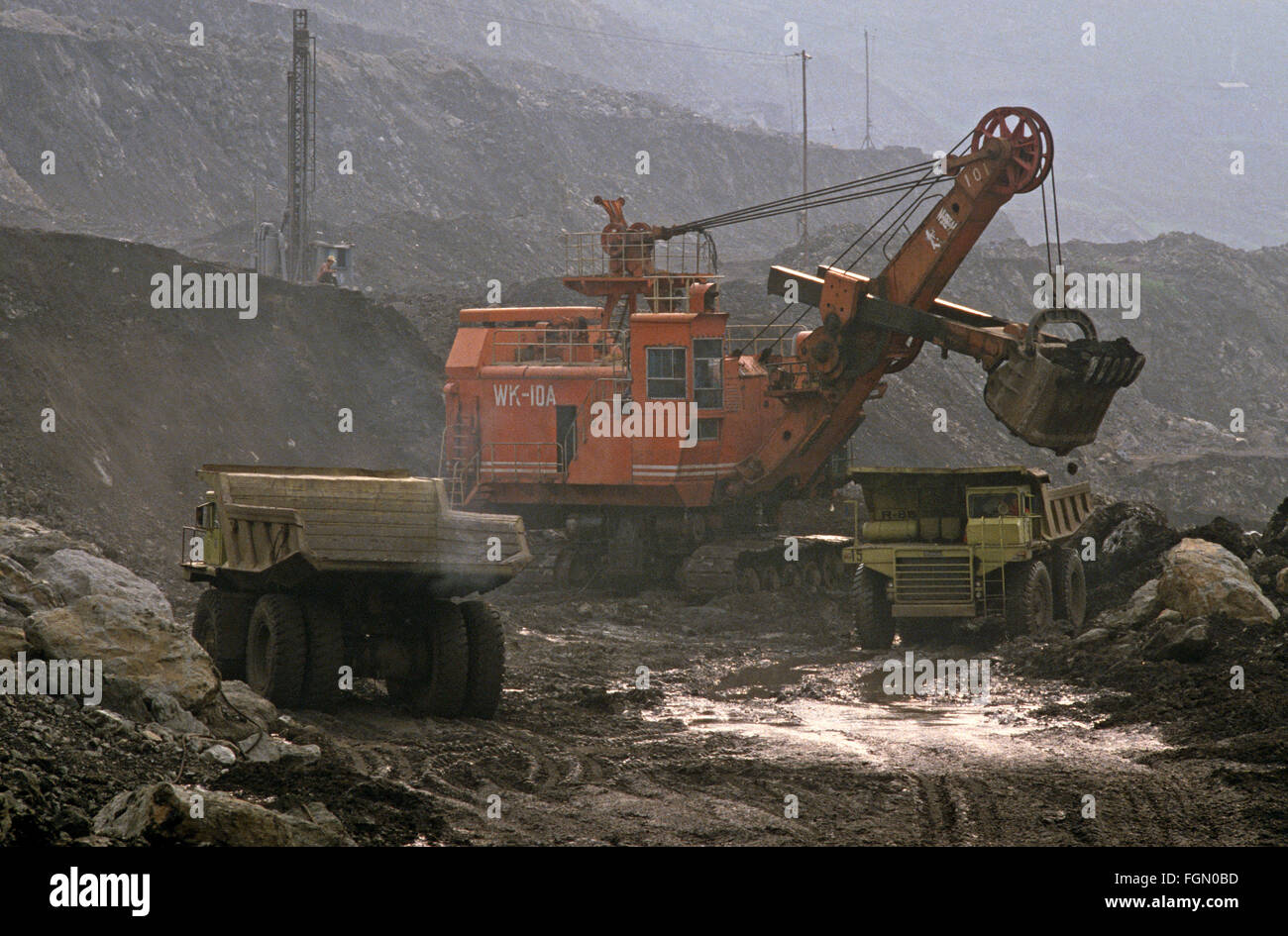 loading coal onto truck in Fushun open cast coal mine, Liaoning ...