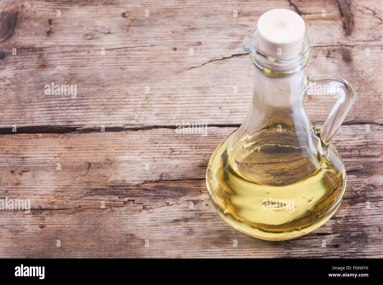 background cooking oil in bottle on wooden rustic table Stock Photo - Alamy