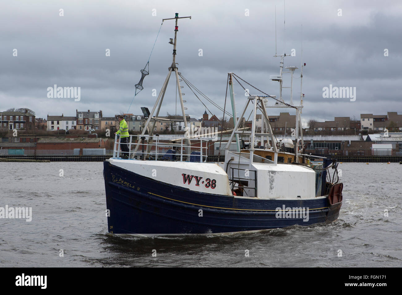 A fishing boat sails into the North Shields Fish Quay in north-east ...