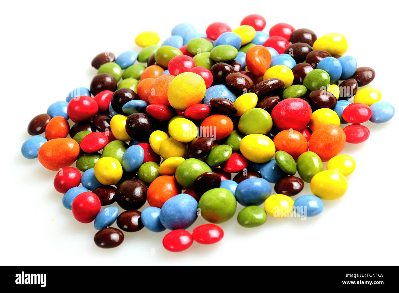 Isolated stack of colorful candies on white background Stock Photo - Alamy