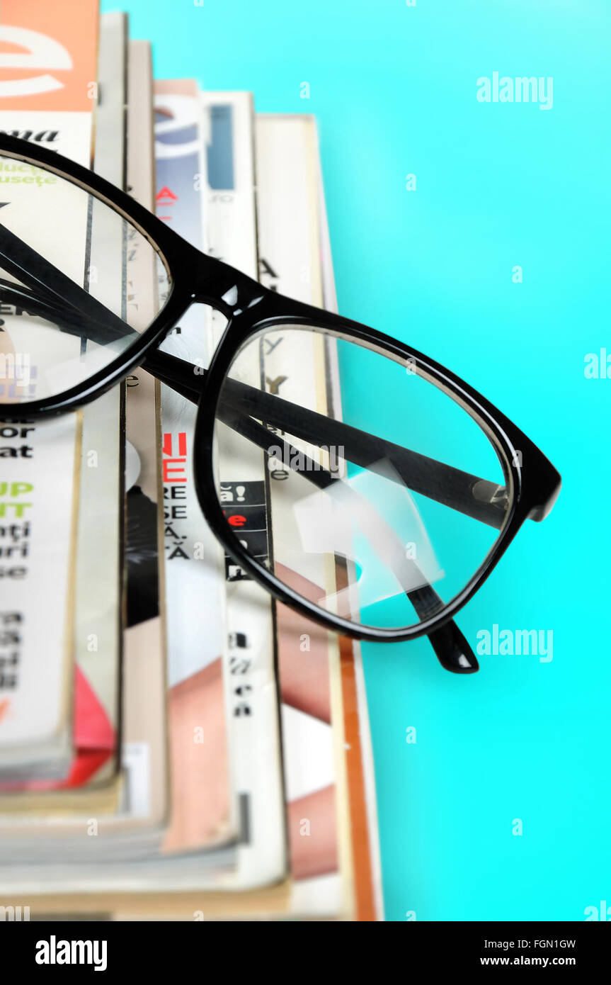 Stacked magazine on blue background Stock Photo - Alamy