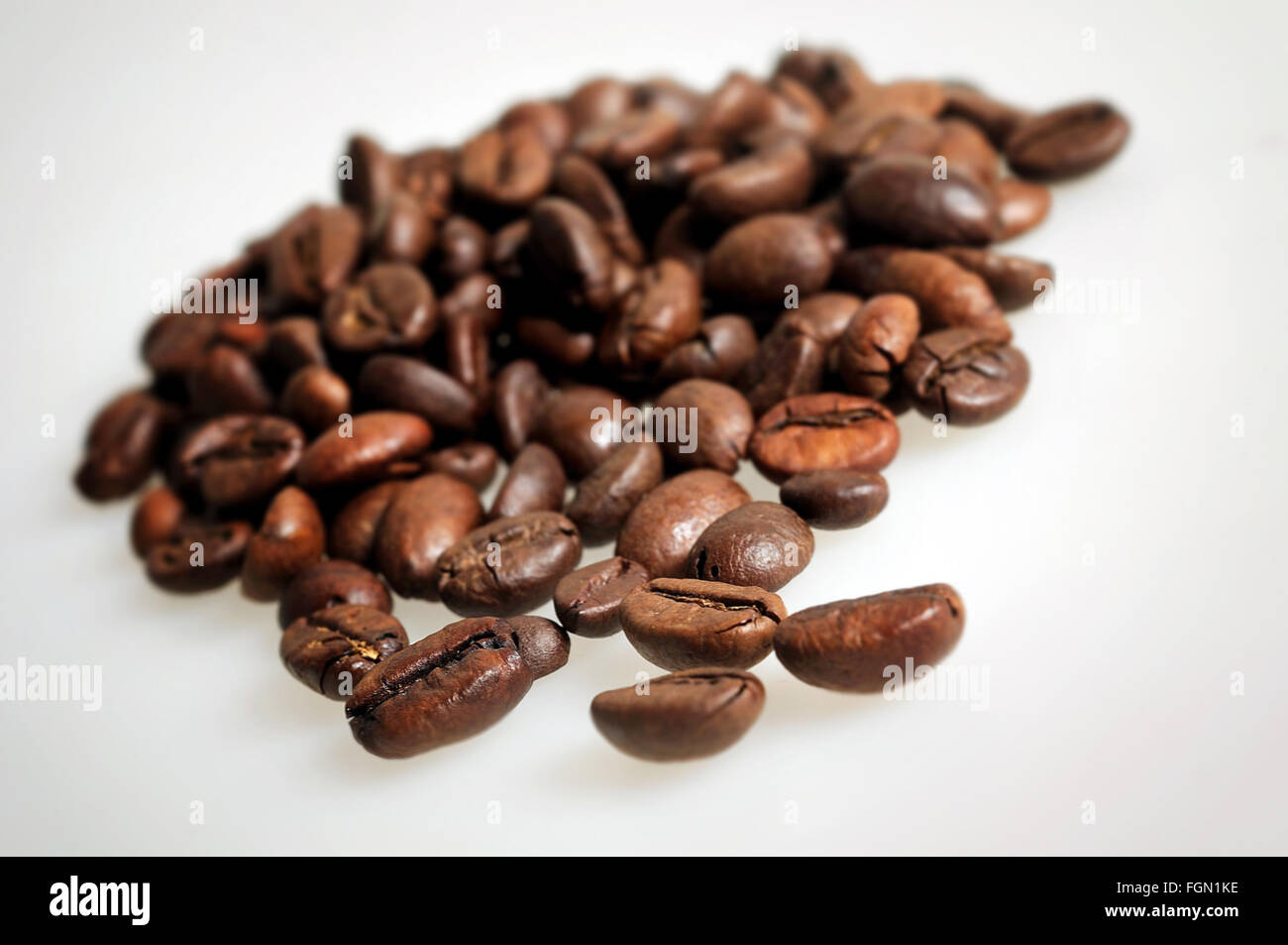 Stack roasted beans on grey background Stock Photo - Alamy
