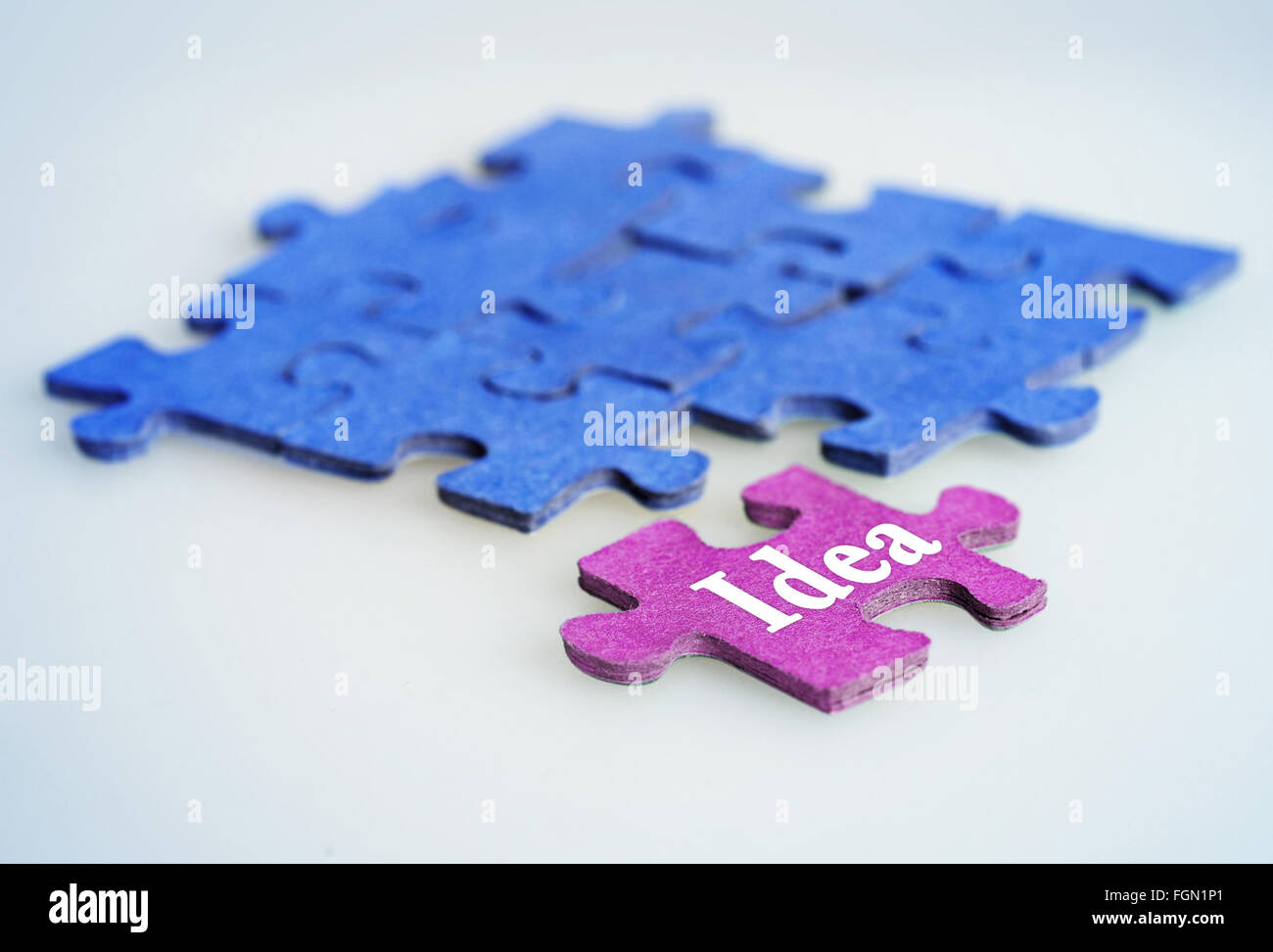 Puzzle with Idea word piece Stock Photo - Alamy