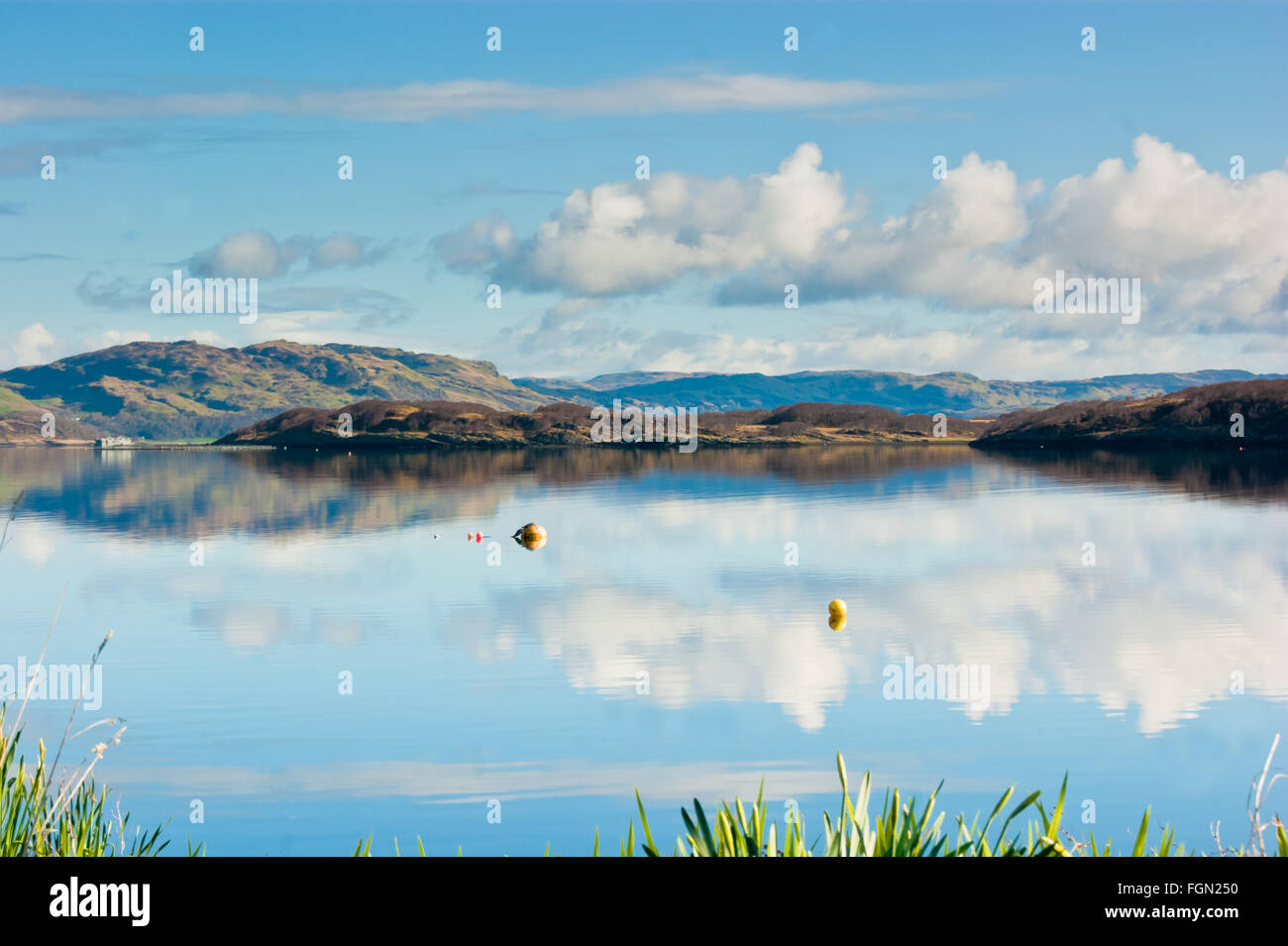 reflections in the water Isle of Luing Stock Photo - Alamy
