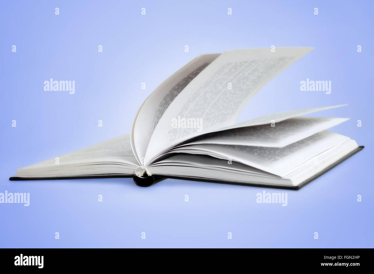 Open book on blue background Stock Photo - Alamy