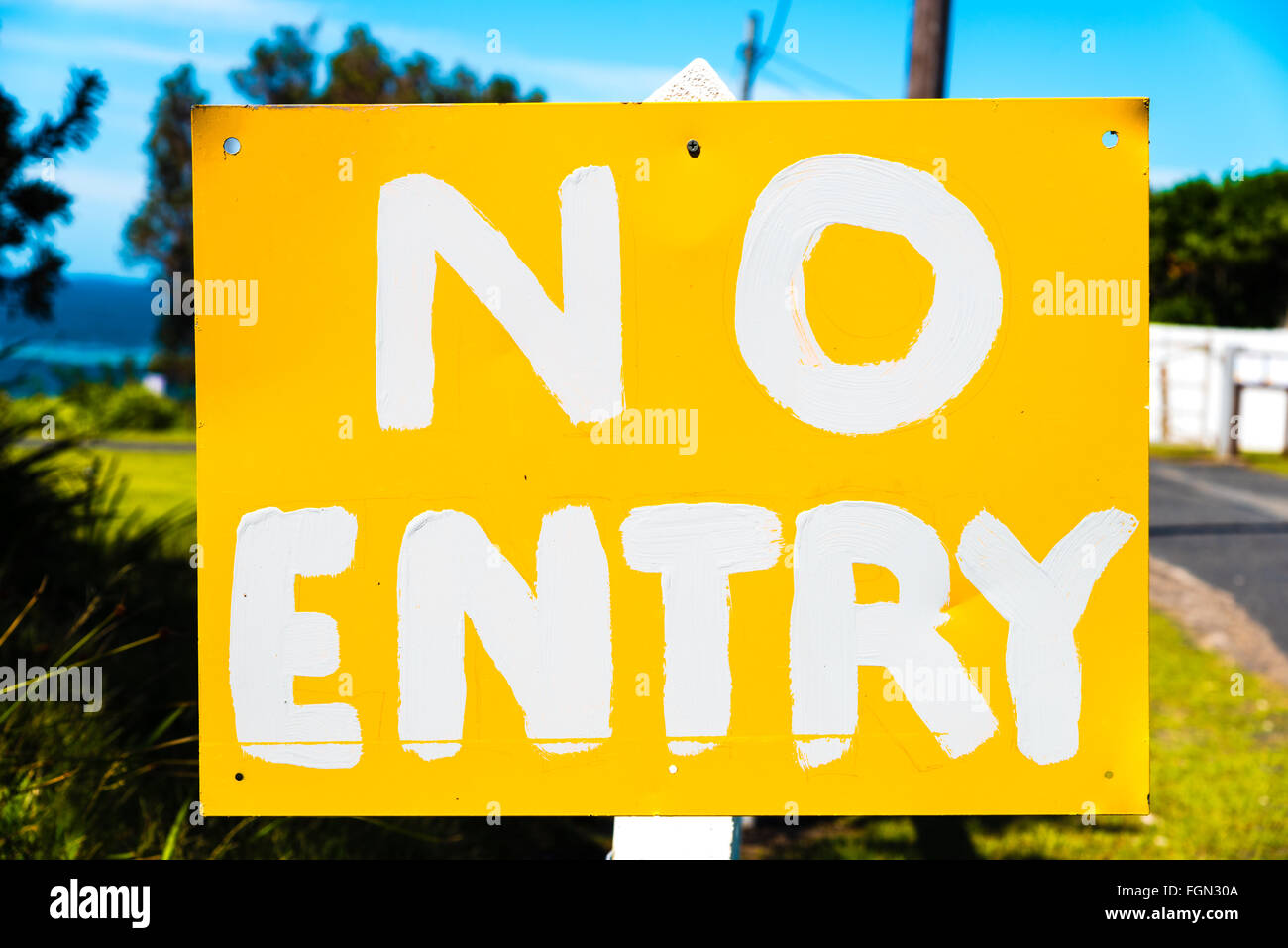 No Entry sign in white and yellow colors Stock Photo - Alamy
