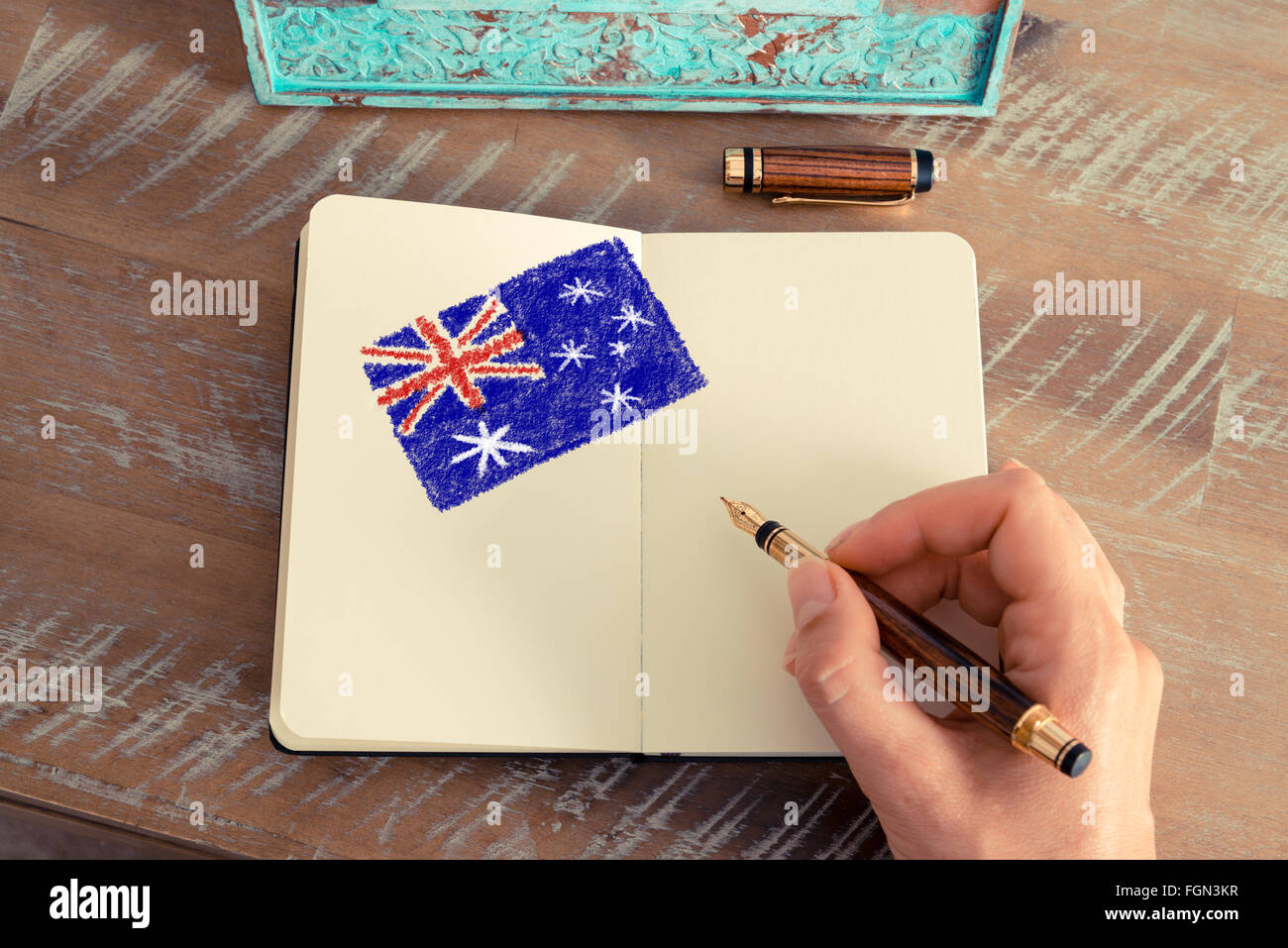 Retro effect and toned image of a woman hand drawing the Australian ...