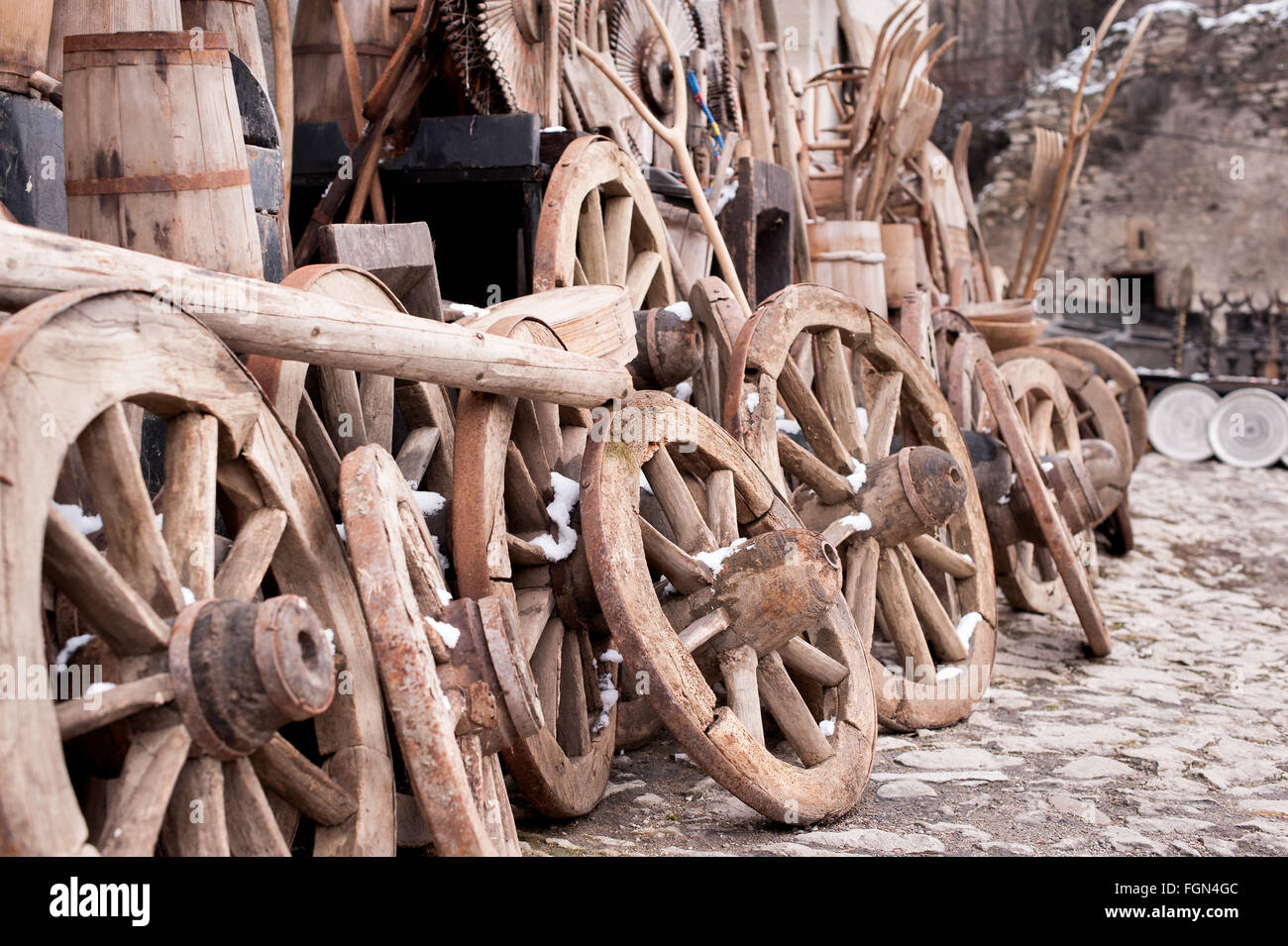 rustic wagon wheels in front of the wall in Safranbolu Karabuk Turkey ...