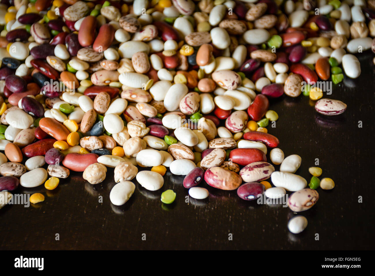 A huge pile of mixed dried beans of all varieties make a colorful ...