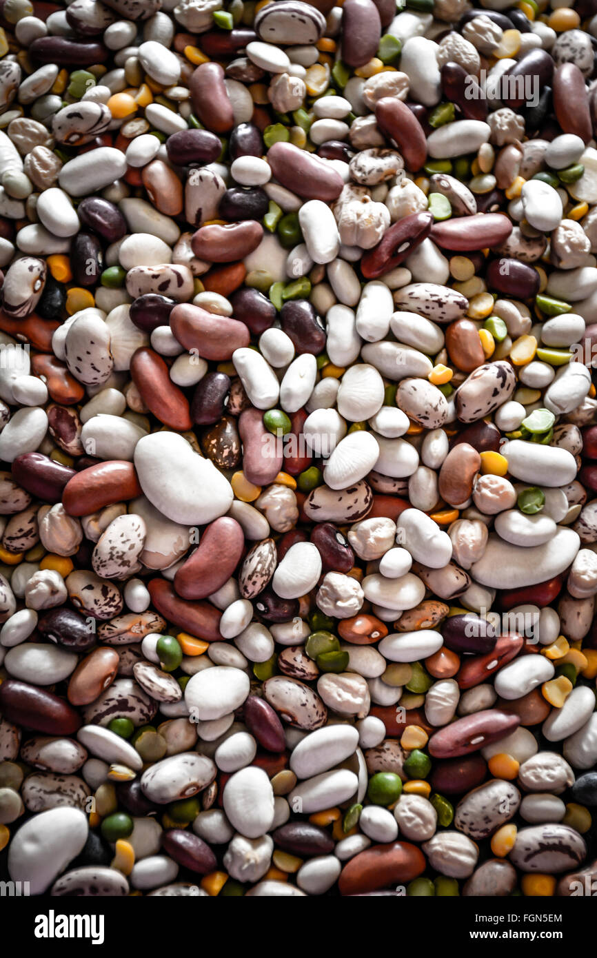 A huge pile of mixed dried beans of all varieties make a colorful ...