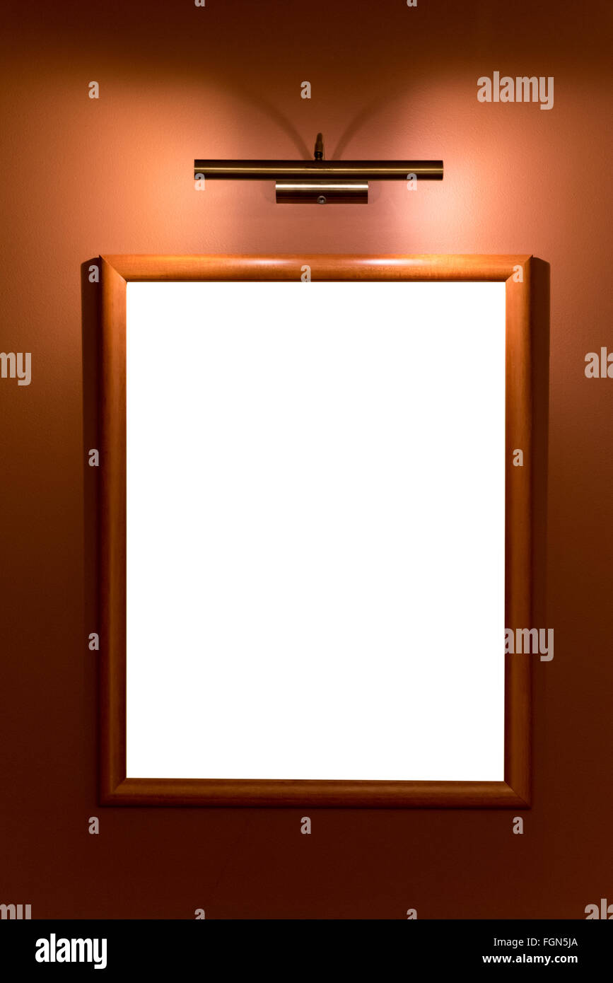 picture frame illuminated by lamp on the wall Stock Photo - Alamy
