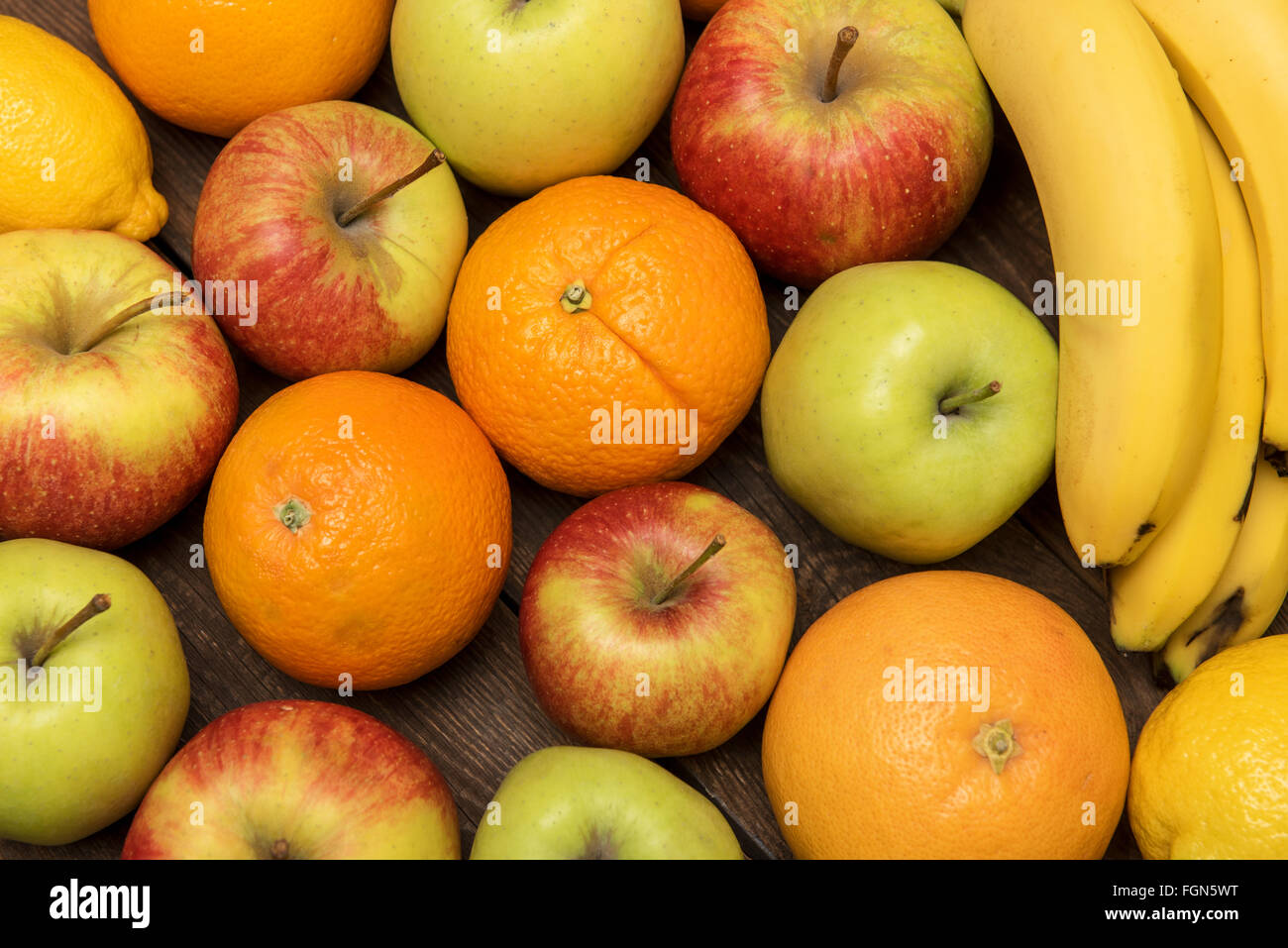 Tasty fruit orange, apples and lemon background Stock Photo - Alamy
