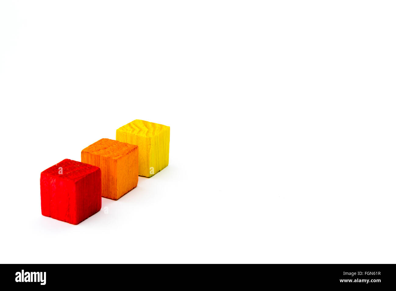 Three toy wooden colored blocks isolated on white background, copy ...
