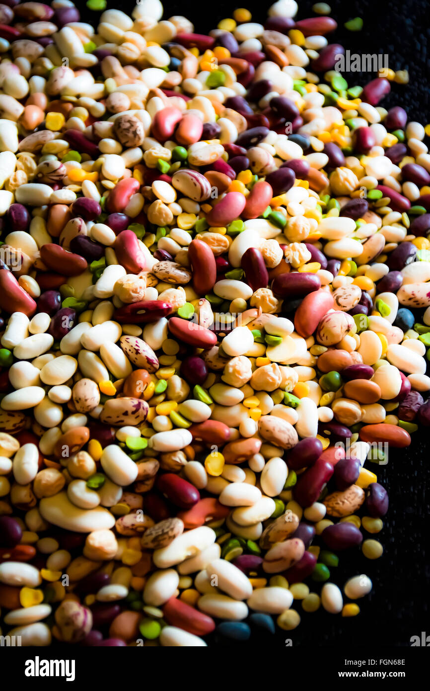 A huge pile of mixed dried beans of all varieties make a colorful ...