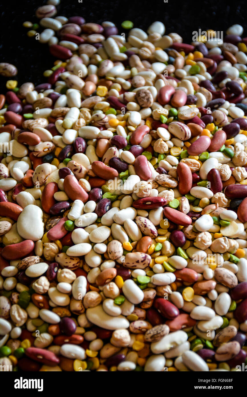 A huge pile of mixed dried beans of all varieties make a colorful ...