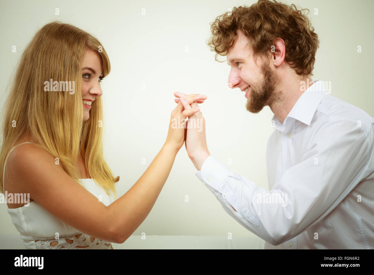 Gorgeous woman and handsome man flirting. Loving couple on date looking ...