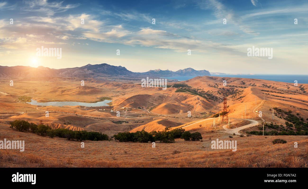 Beautiful panoramic view at the mountain valley with cloudy blue sky at ...