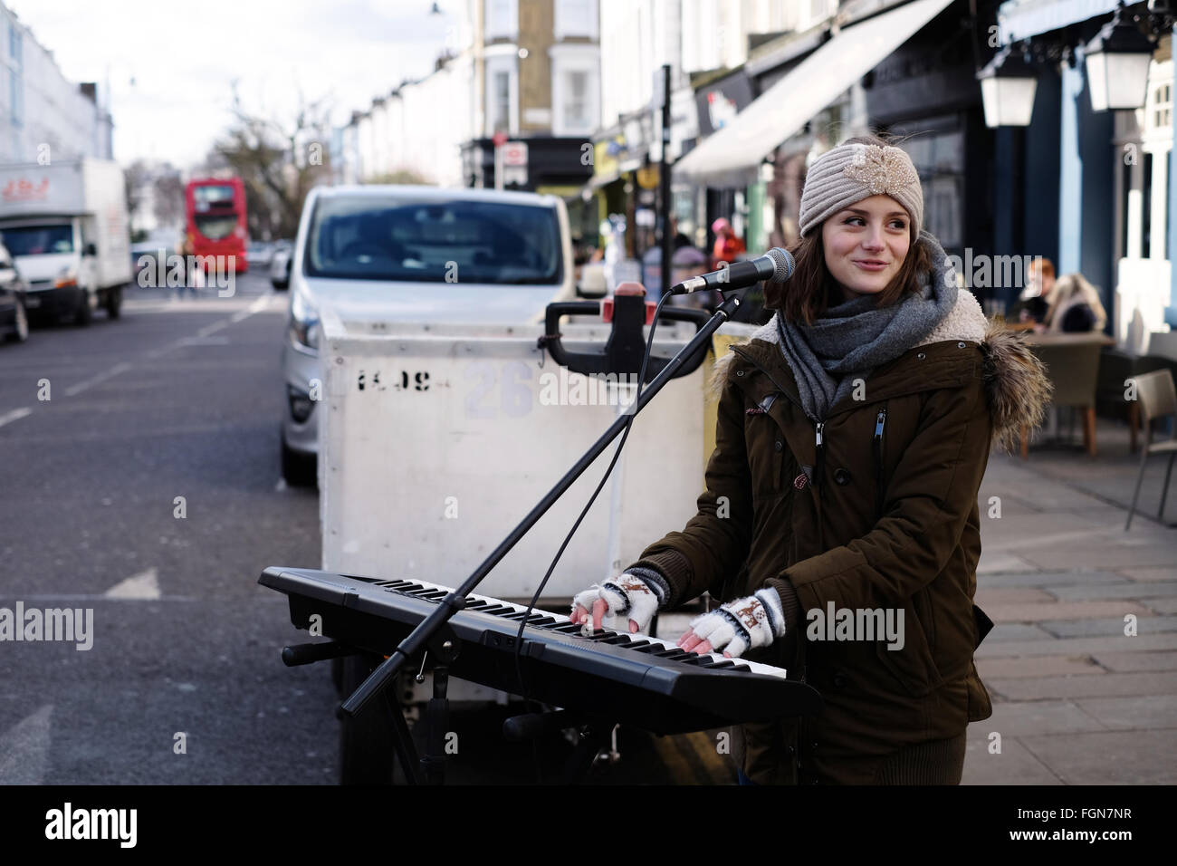 A busker playing keyboard in the street on Portobello Road, London ...