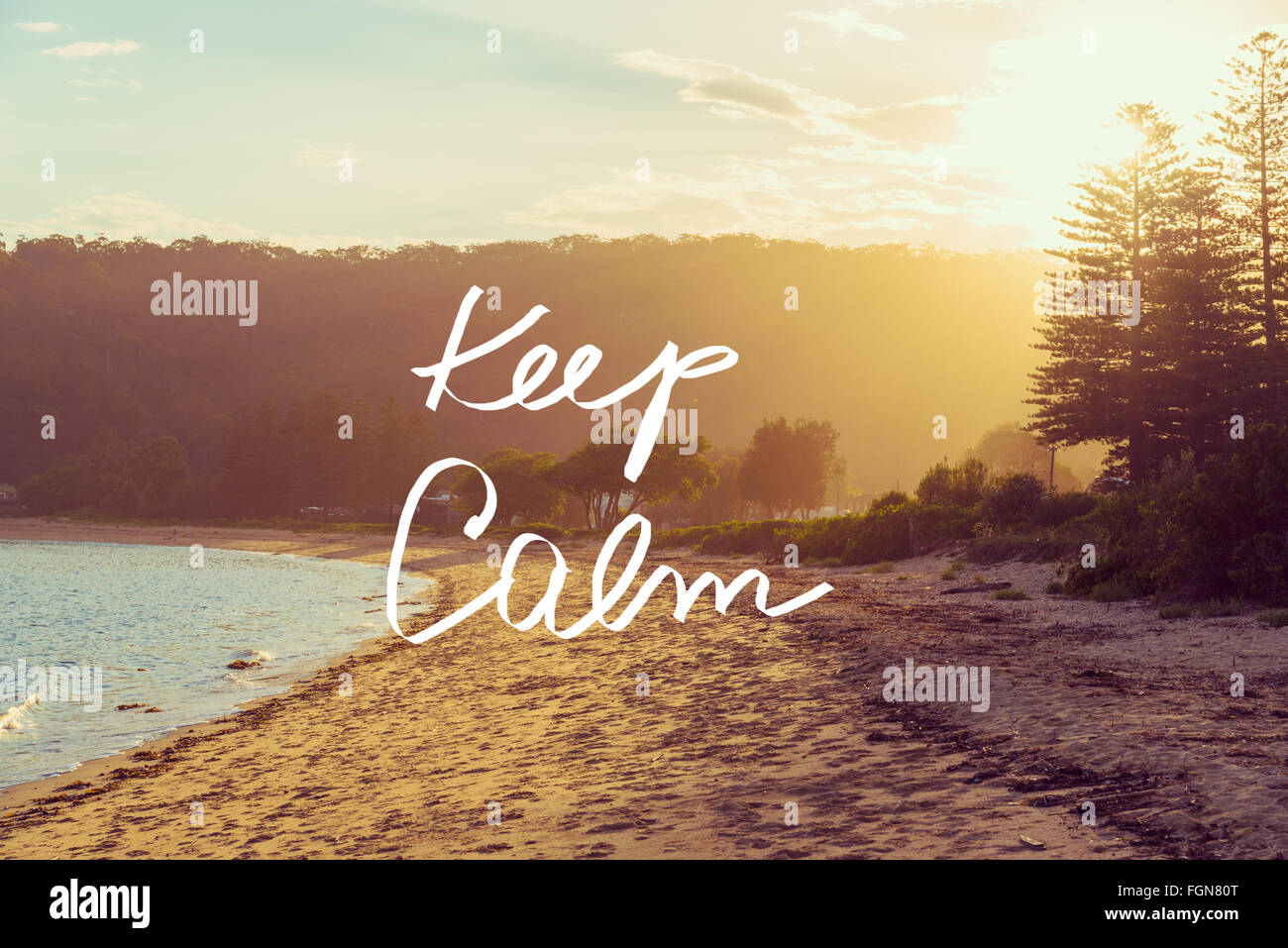 Handwritten text over sunset calm sunny beach background, KEEP CALM ...