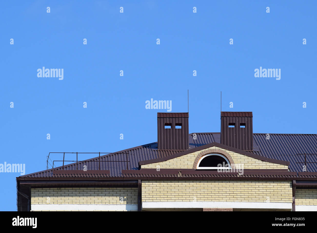 The roof of a multistory building. The roof of the metal sheets ...