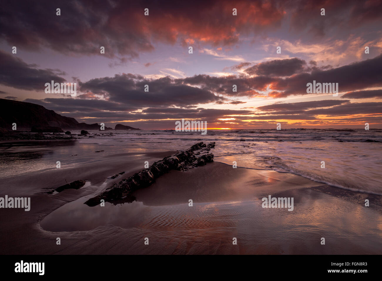 Sunset at Welcombe Mouth Beach in North Devon, UK. There is a beautiful ...
