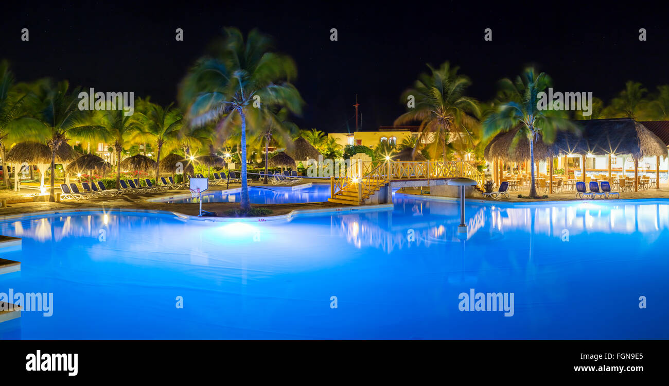 Panorama of hotel and swimming pool at night Stock Photo - Alamy