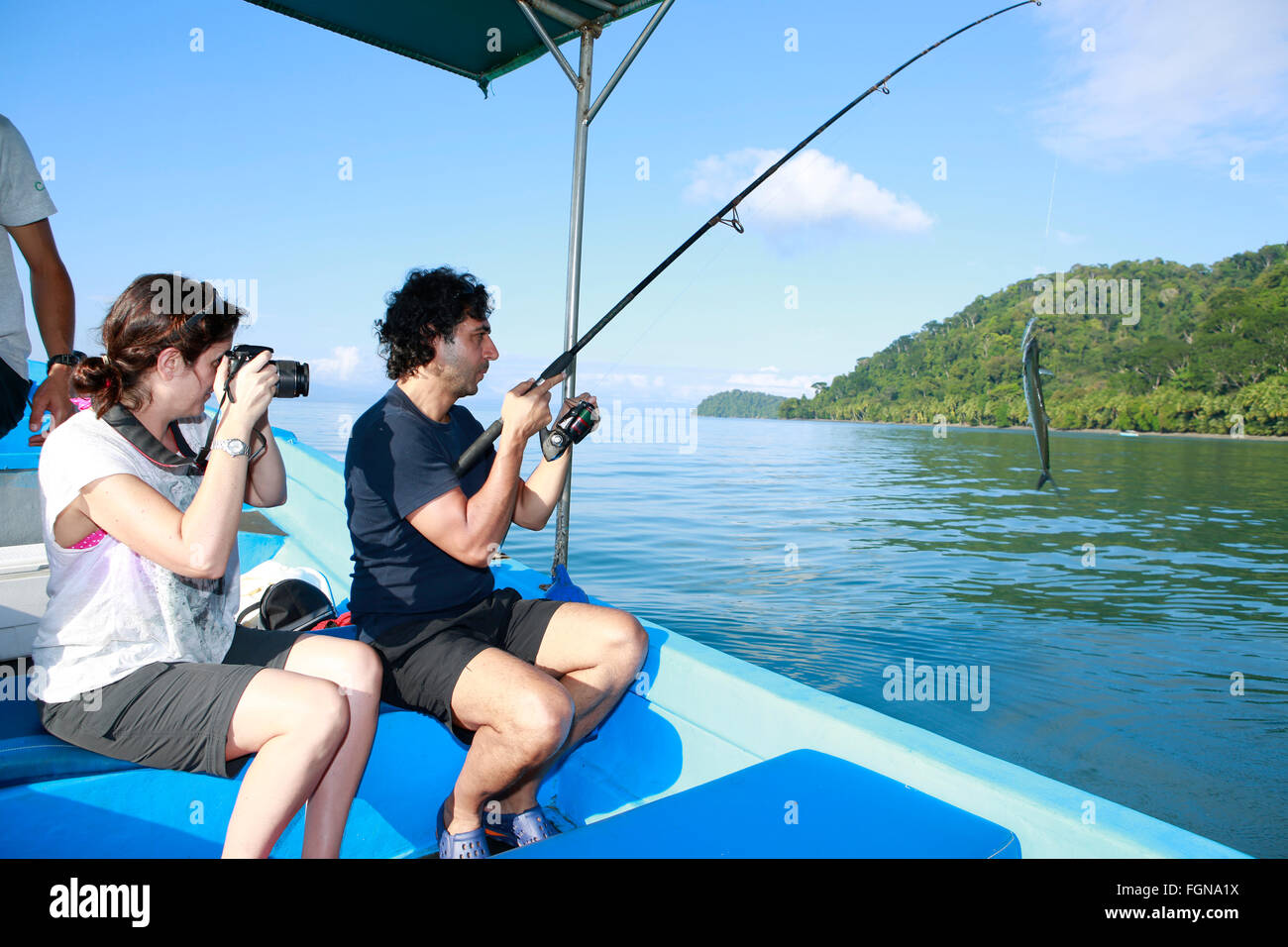 A mixed race Indian and Caucasian couple sports fishing together in Costa Rica Stock Photo - Alamy