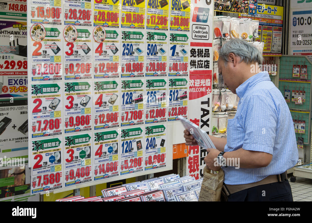 Tokyo Japan modern high tech area called Akihabara area man looking to ...