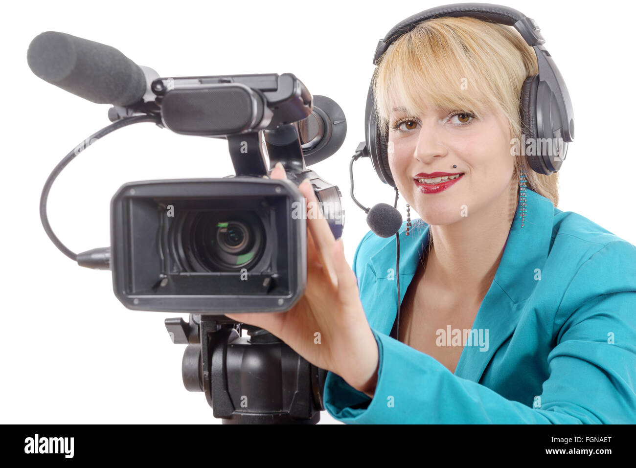 a beautiful young woman with blue suit and professional video camera ...