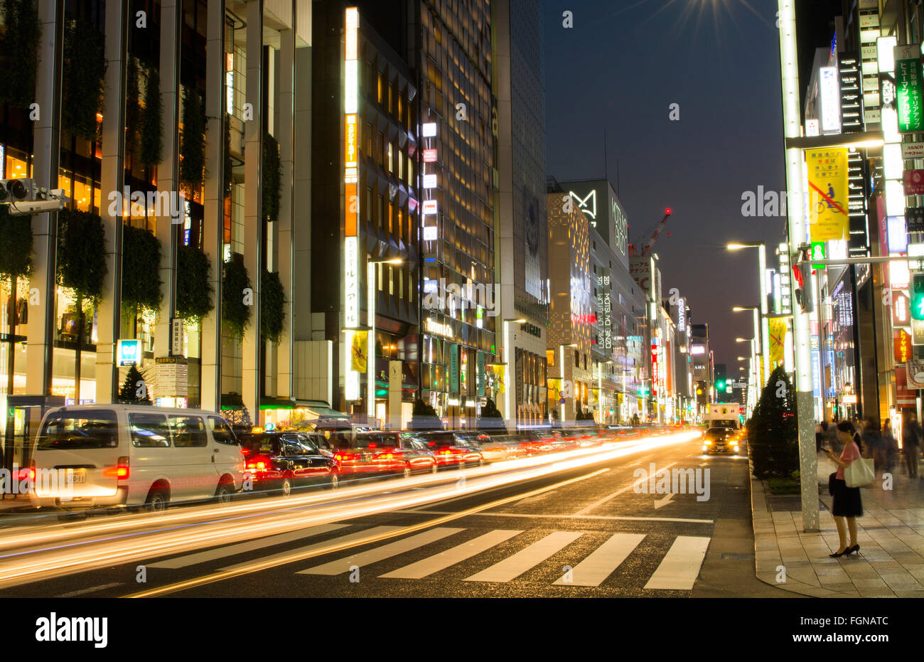 Tokyo Japan local crowds Ginza shopping twilight traffic blurs of ...
