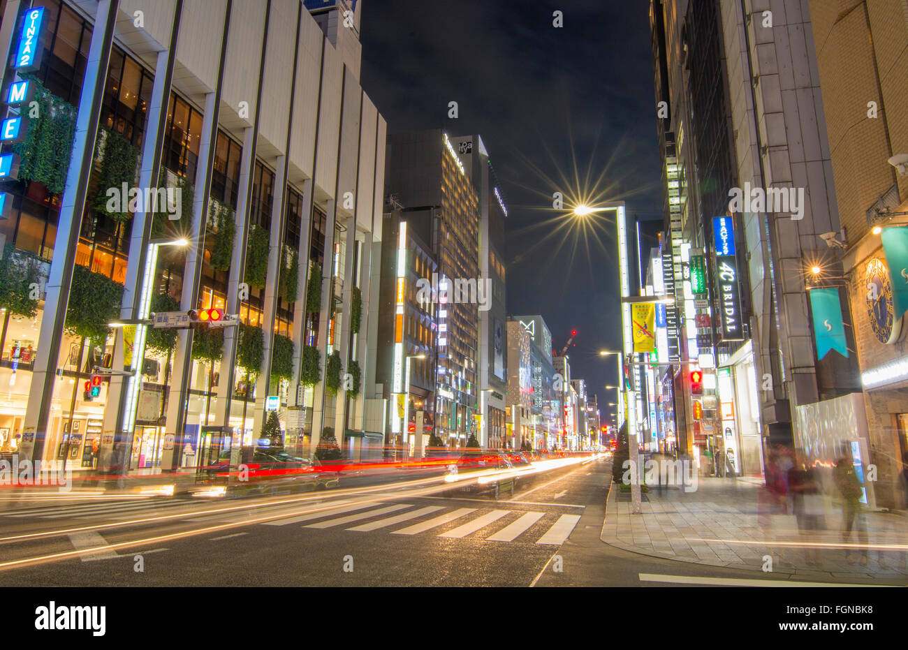 Tokyo Japan local crowds Ginza shopping twilight traffic blurs of ...