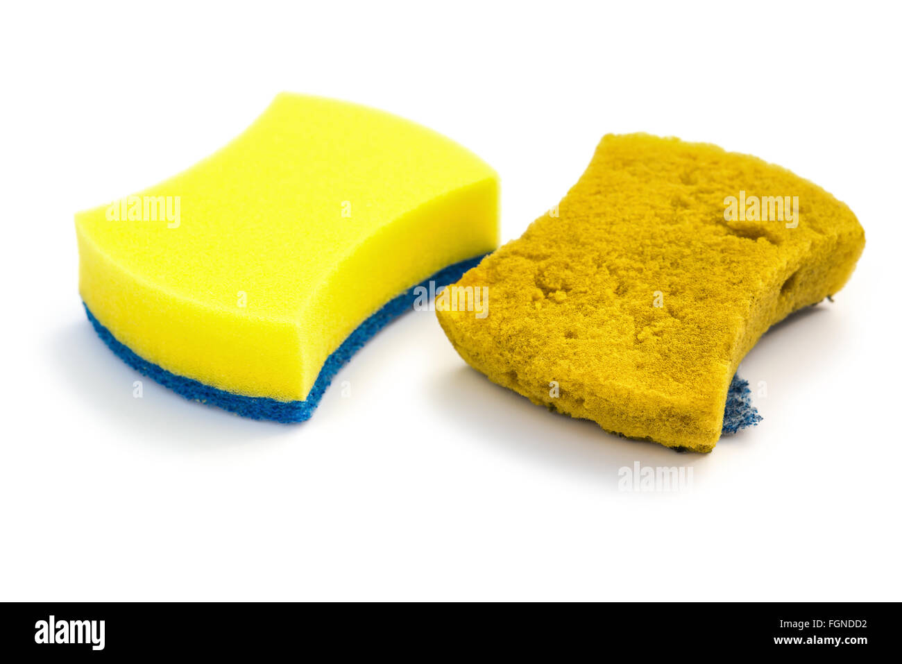side view new & old double-side cleaning sponge on a white background ...