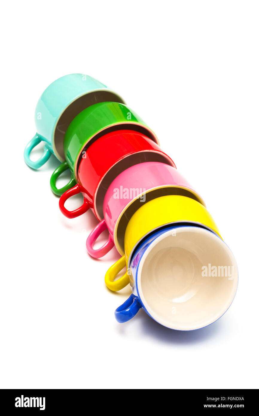 Beautiful color cups on a white background Stock Photo - Alamy