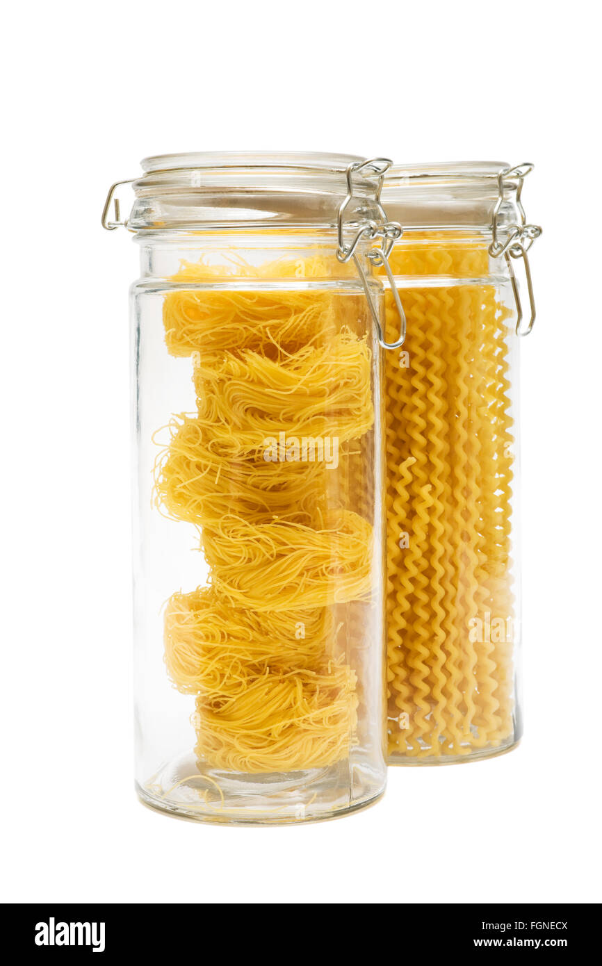 pasta in glass jar on a white background Stock Photo - Alamy