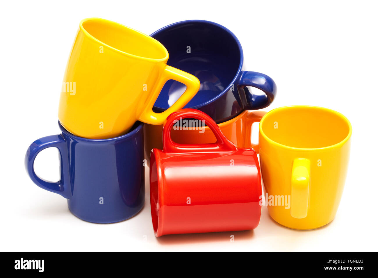 Beautiful color cups on a white background Stock Photo - Alamy