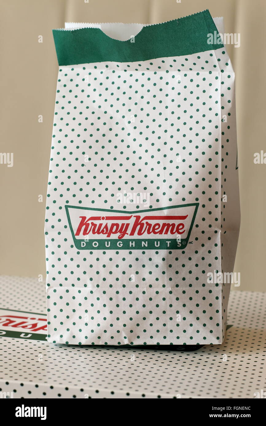 Krispy Kreme doughnuts paper bag Stock Photo - Alamy