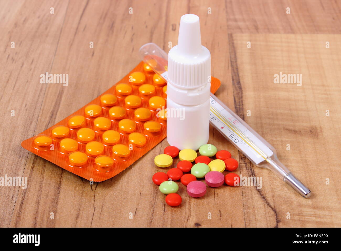 Pills, thermometer and nose drops for colds, treatment of colds, flu ...