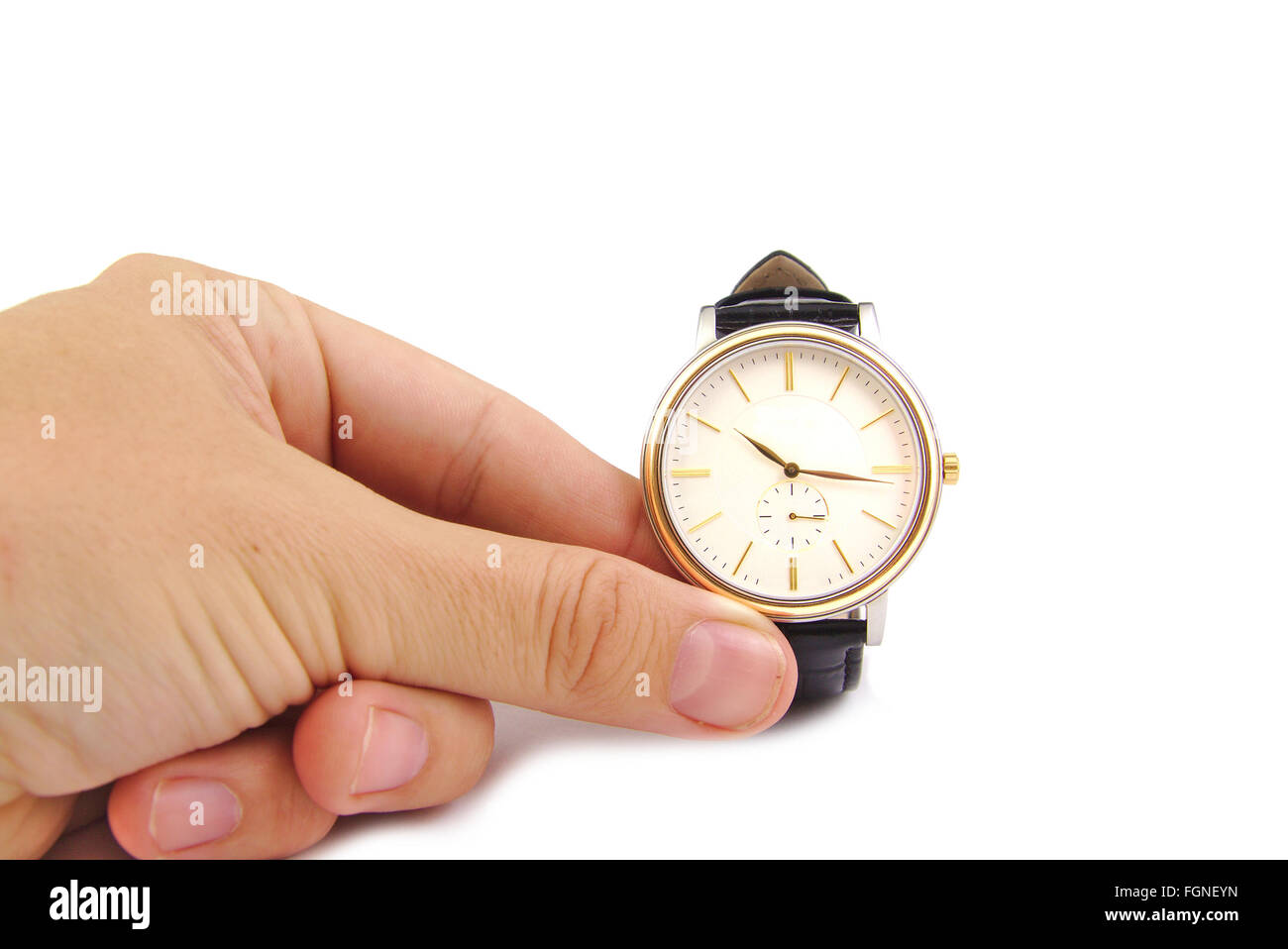 Close up of hand holding watch, isolated on a white background. Time ...