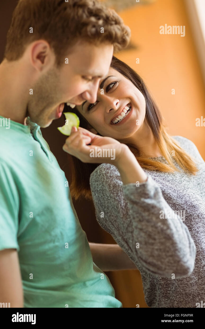 Cute couple preparing food together Stock Photo - Alamy