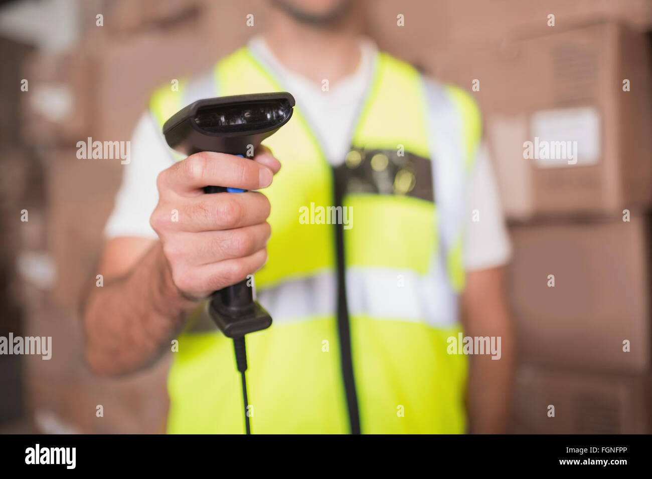 Mid section of worker holding scanner in warehouse Stock Photo - Alamy