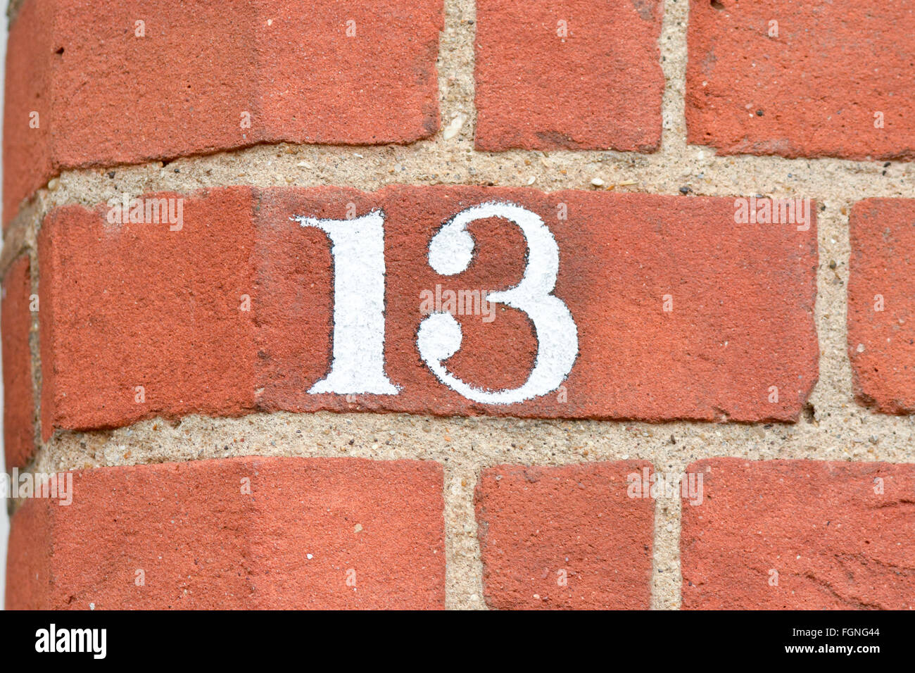 House number 13 sign painted on wall Stock Photo - Alamy
