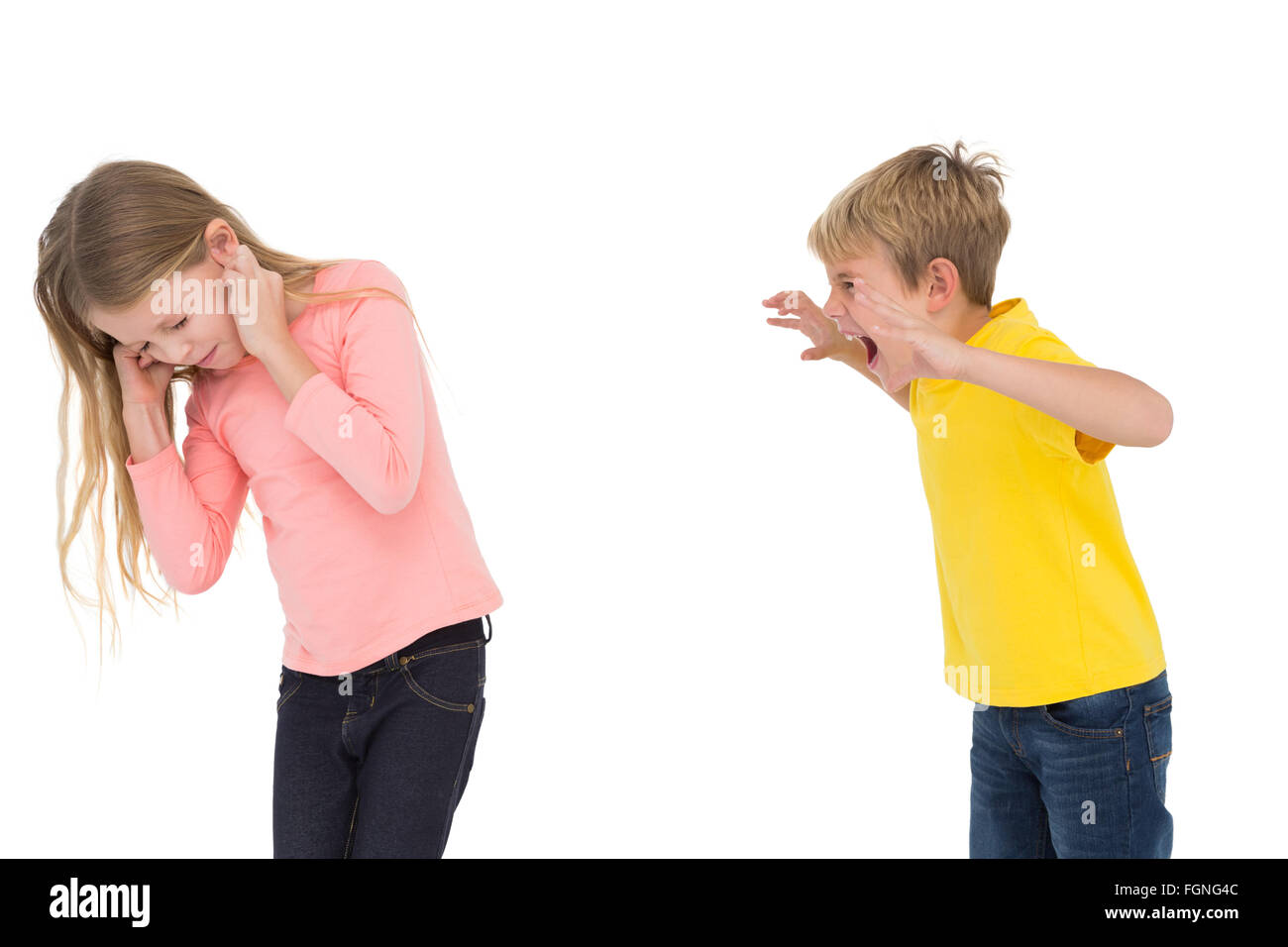 Little boy scaring his sister Stock Photo - Alamy